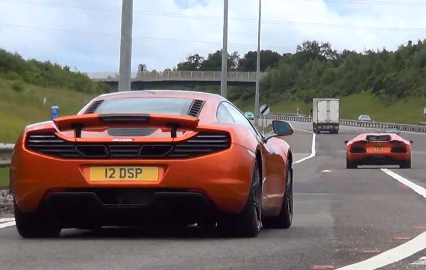 50 Supercars Accelerating Onto A Motorway